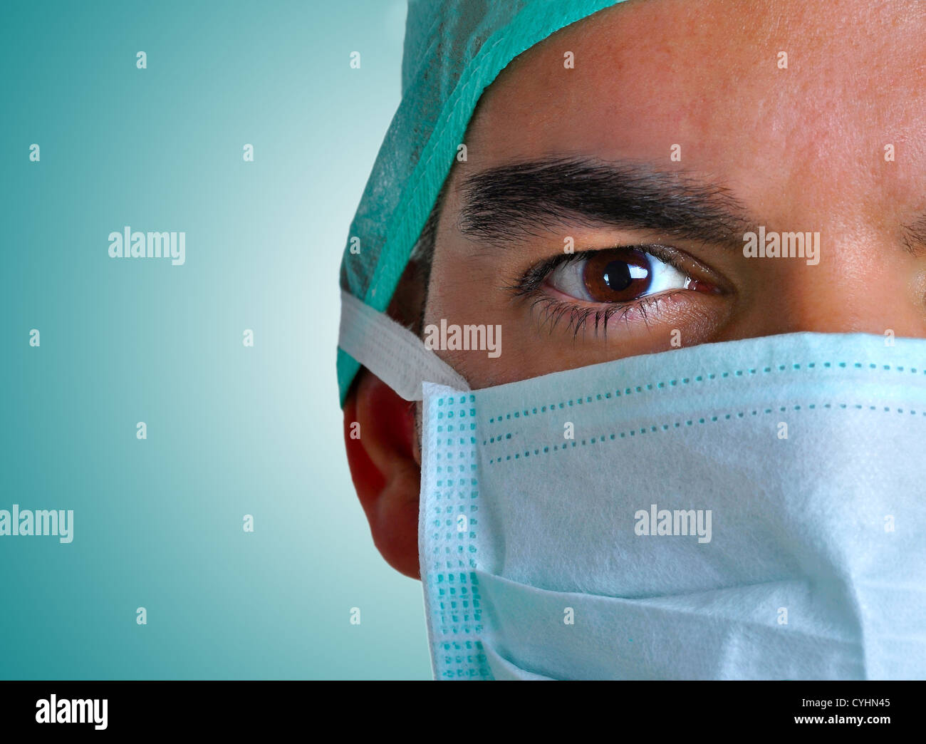 Closeup portrait of a surgeon with a green background behind Stock ...