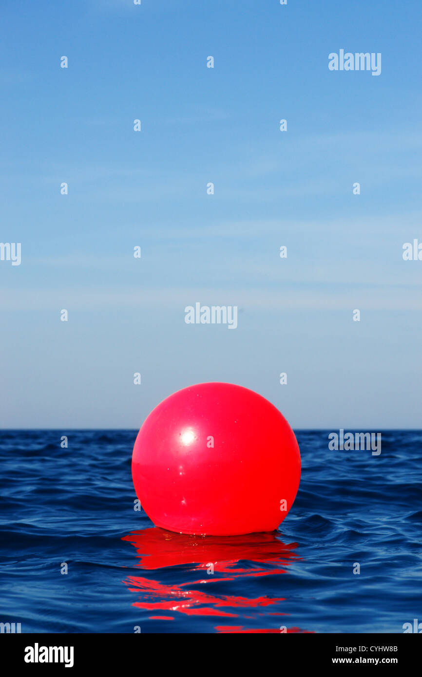 close-up of a red bouy in the ocean Stock Photo - Alamy