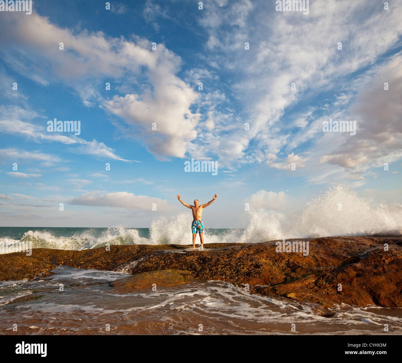 men in the waves Stock Photo - Alamy