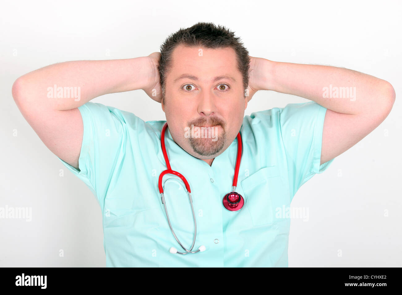 Medic with his hands to his head Stock Photo - Alamy