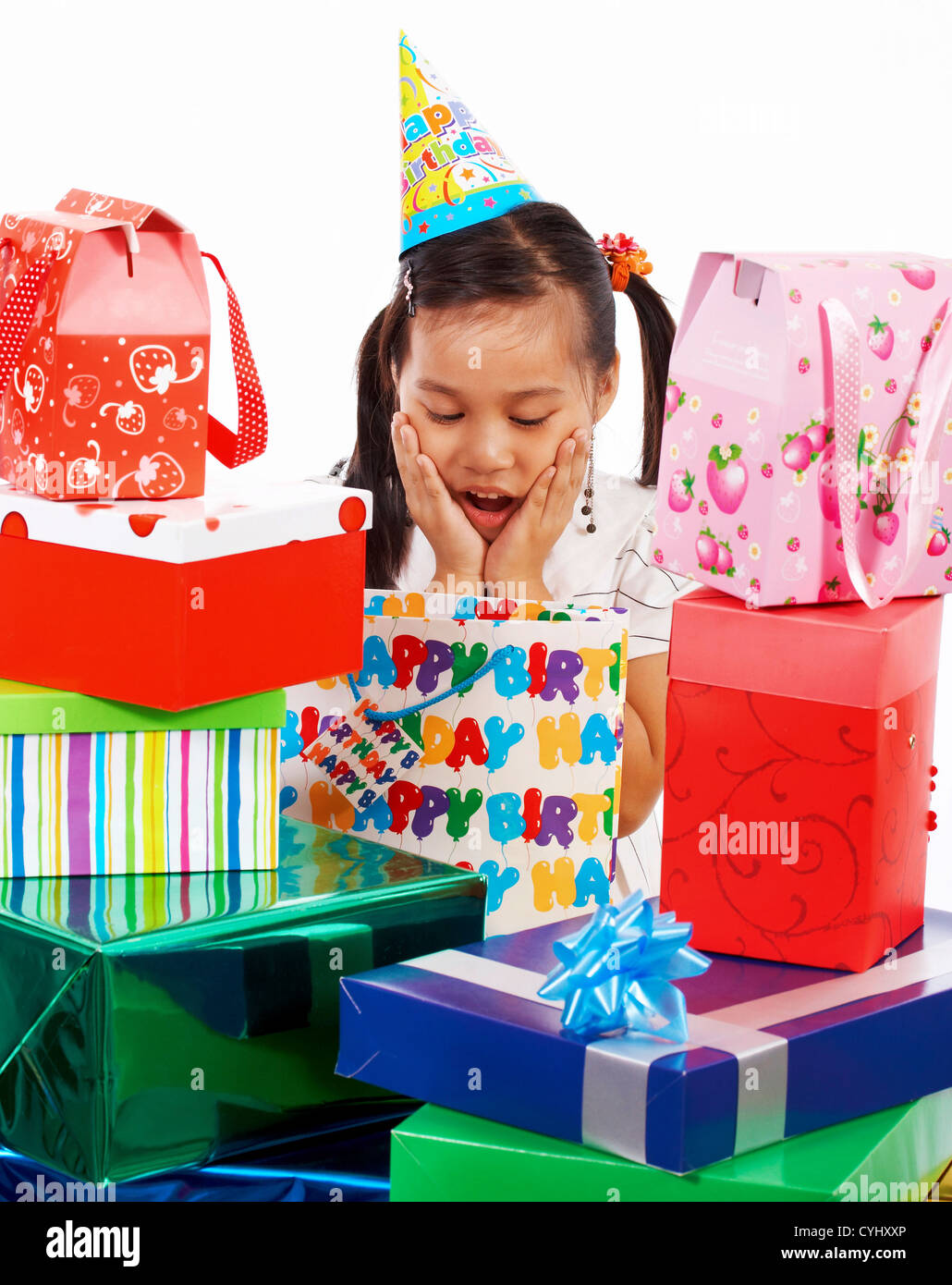 Girl Excited On Her Birthday As She Receives Many Gifts Stock Photo - Alamy
