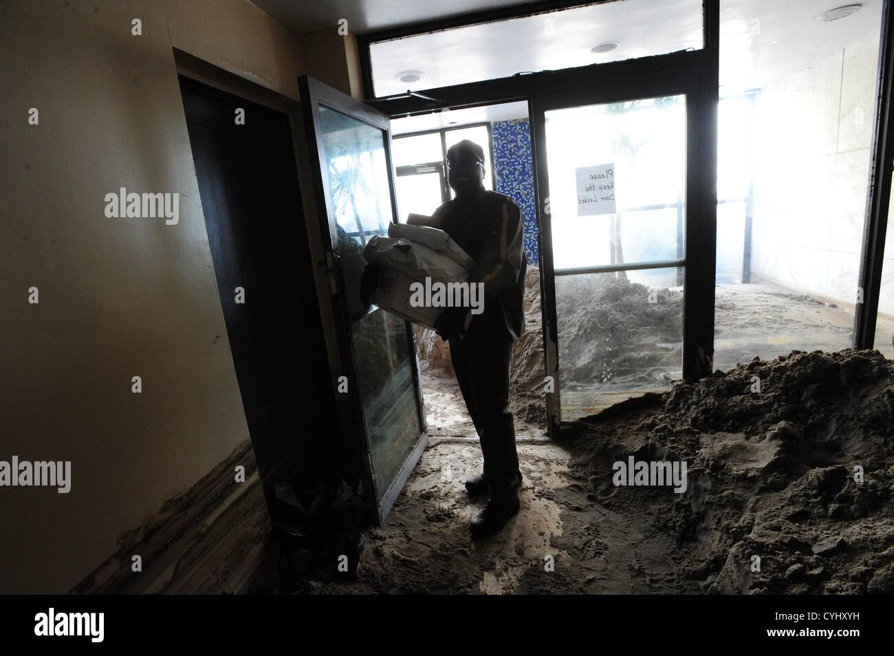 Nov. 5, 2012 - Queens, New York, U.S. - A UPS man attempts deliveries ...