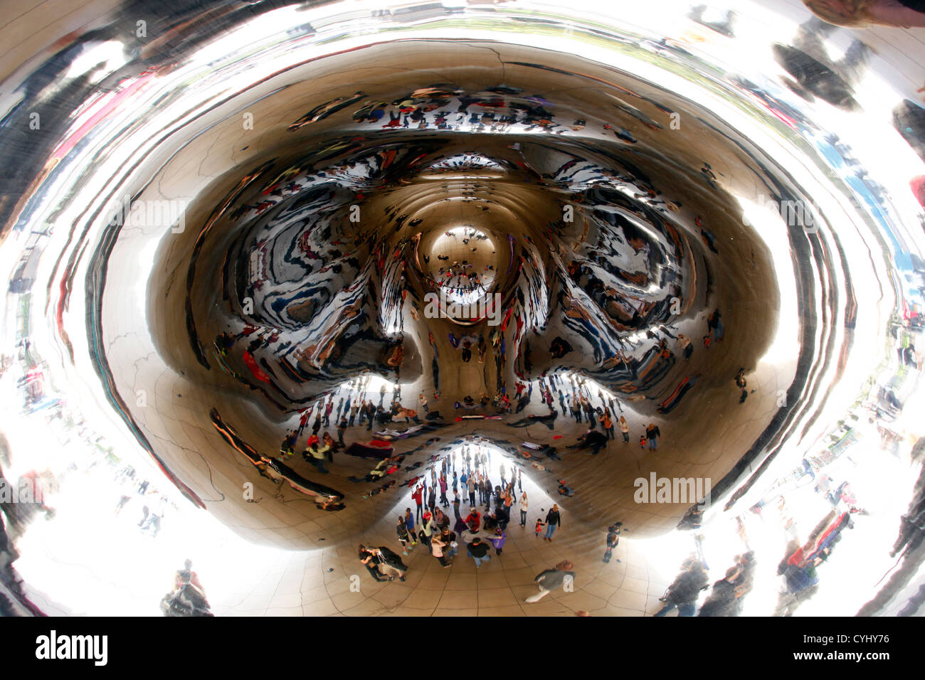 Reflection of tourists and people in the Cloud Gate Sculpture (aka ...