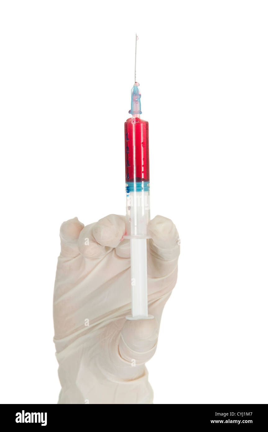 Close up hand holding syringe hi-res stock photography and images - Alamy