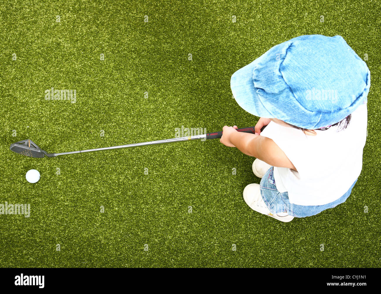 Small Child Copying Her Father Playing Golf On The Putting Green Stock ...