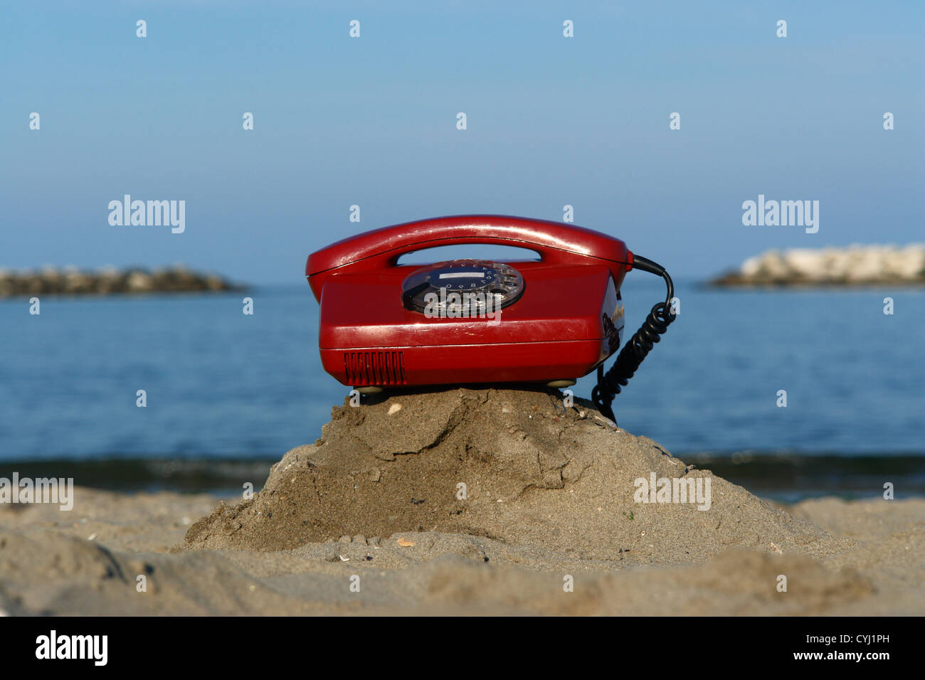 red phone on the beach on a nice day Stock Photo - Alamy