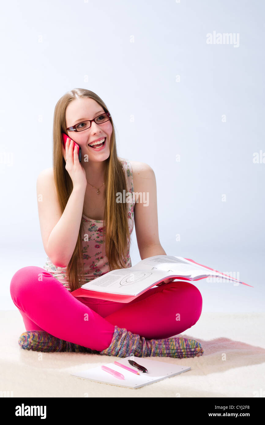 A young beautiful girl student smiling and she has a phone call Stock ...