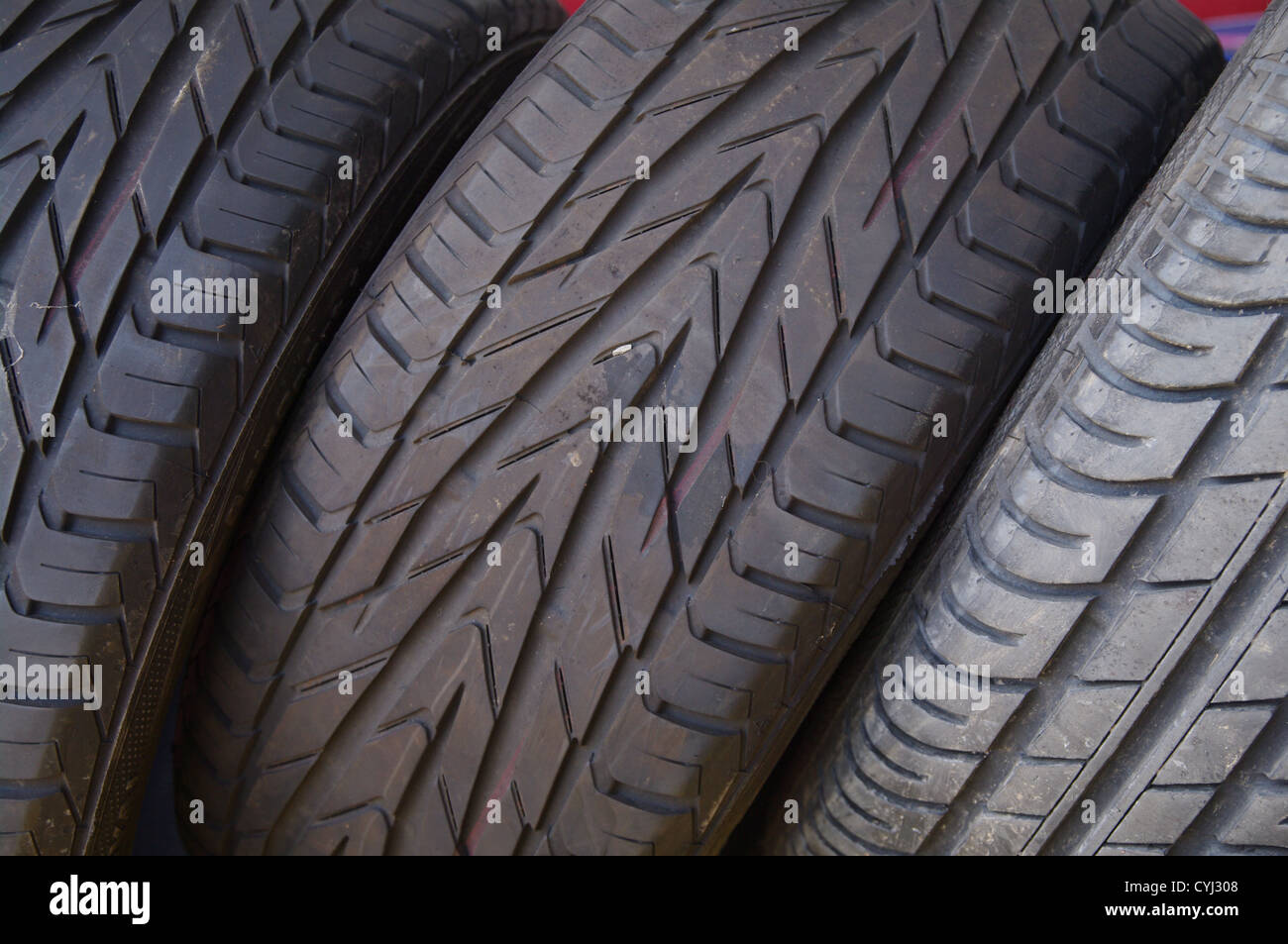 stack of used car wheels Stock Photo - Alamy