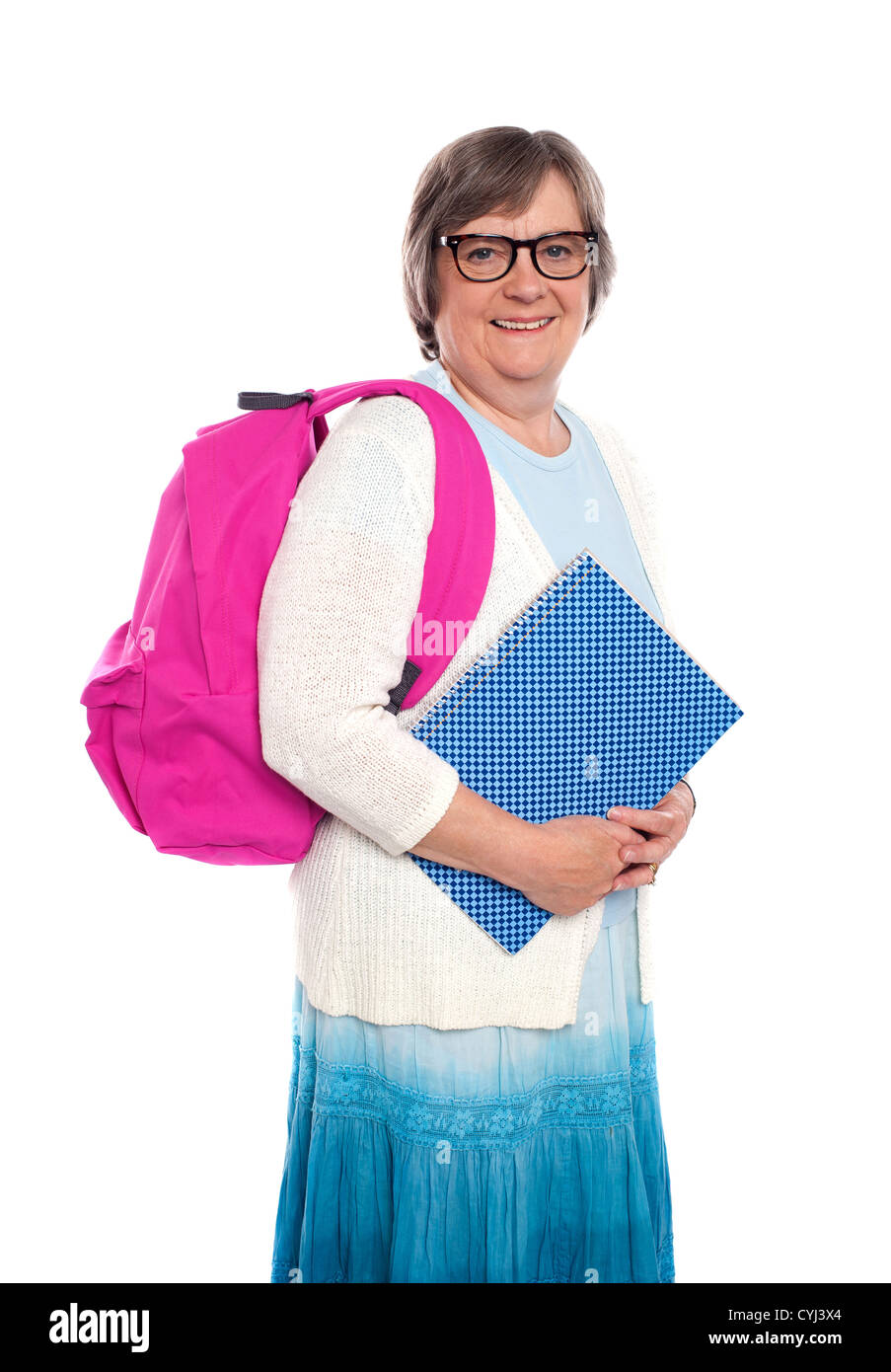 Recalling old school days. Senior woman posing with bag and notebook ...