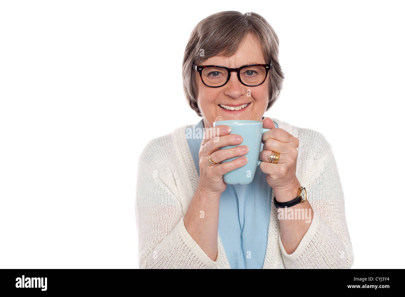 Smiling lady drinking hot coffee in front of camera Stock Photo - Alamy