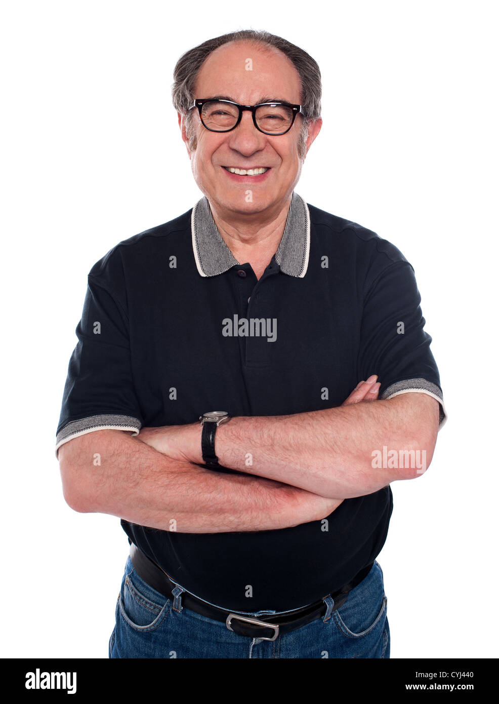 Cheerful old man standing with arms crossed against white background ...