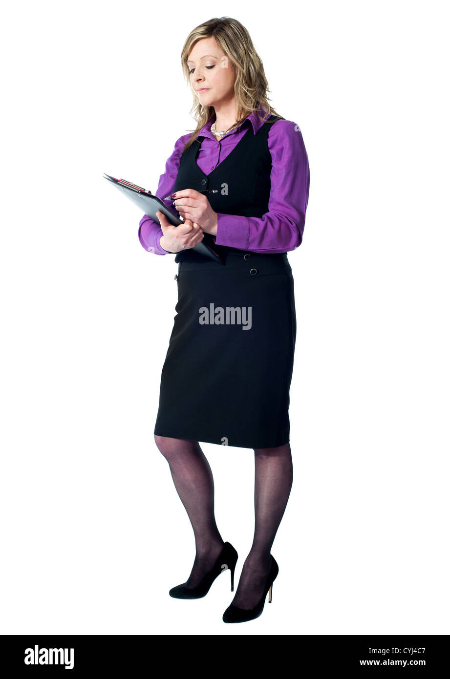 Female secretary writing on clipboard, making notes. Full length view ...