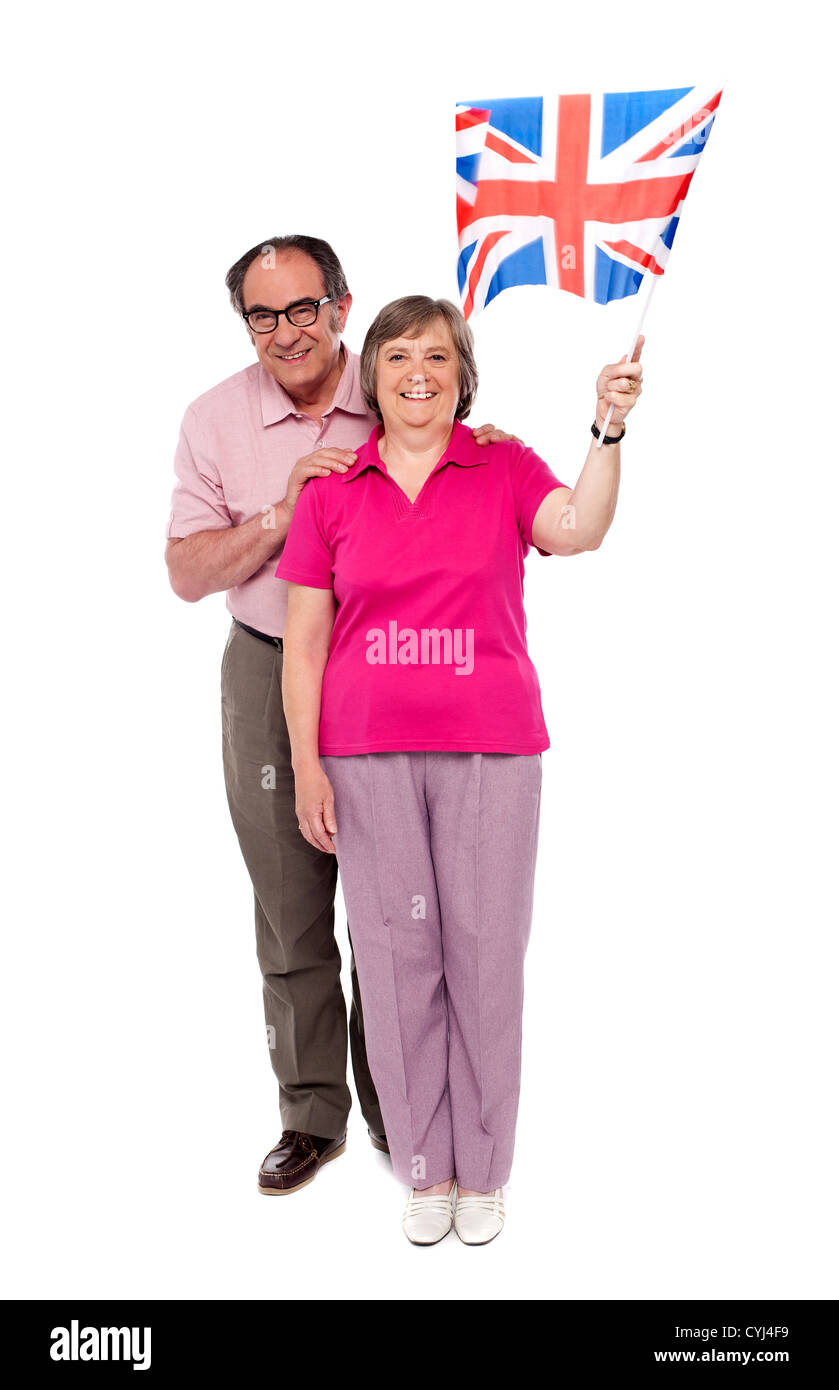Old couple waving UK flag. Supporting nation and cheering Stock Photo ...