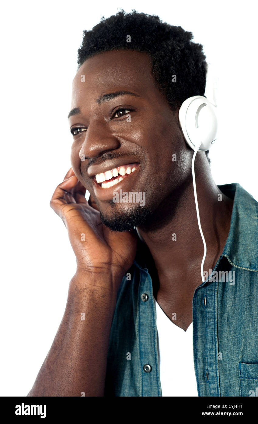 Young man with headphones enjoying music Stock Photo - Alamy