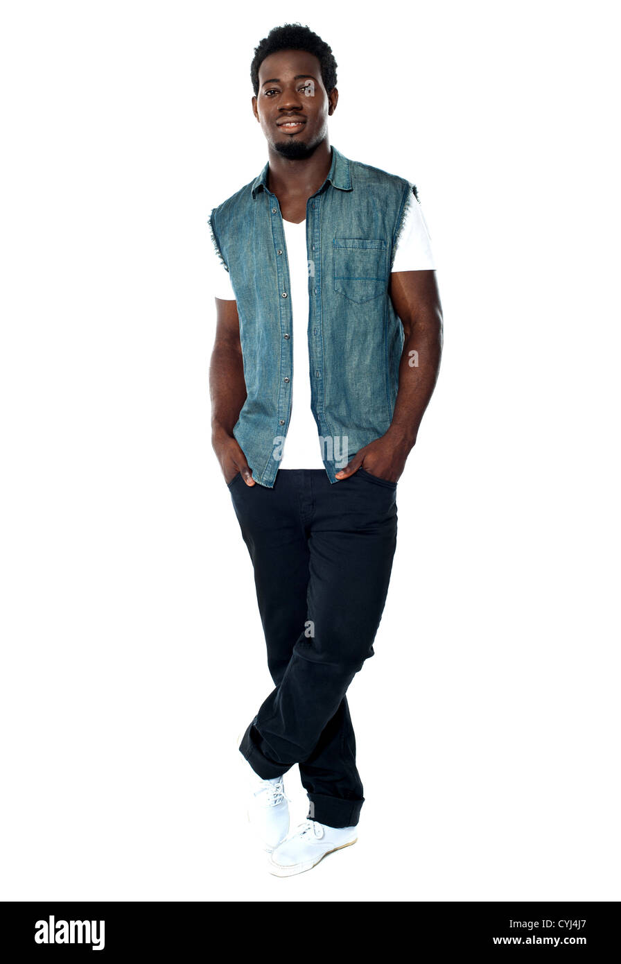 Full body pose of young african male model posing in casuals with legs ...