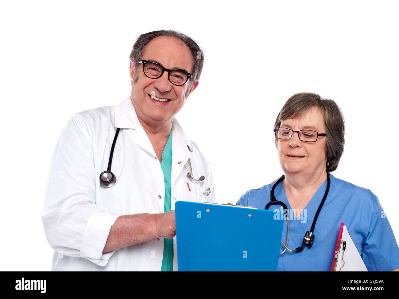 Senior doctors reading medical report isolated against white background ...