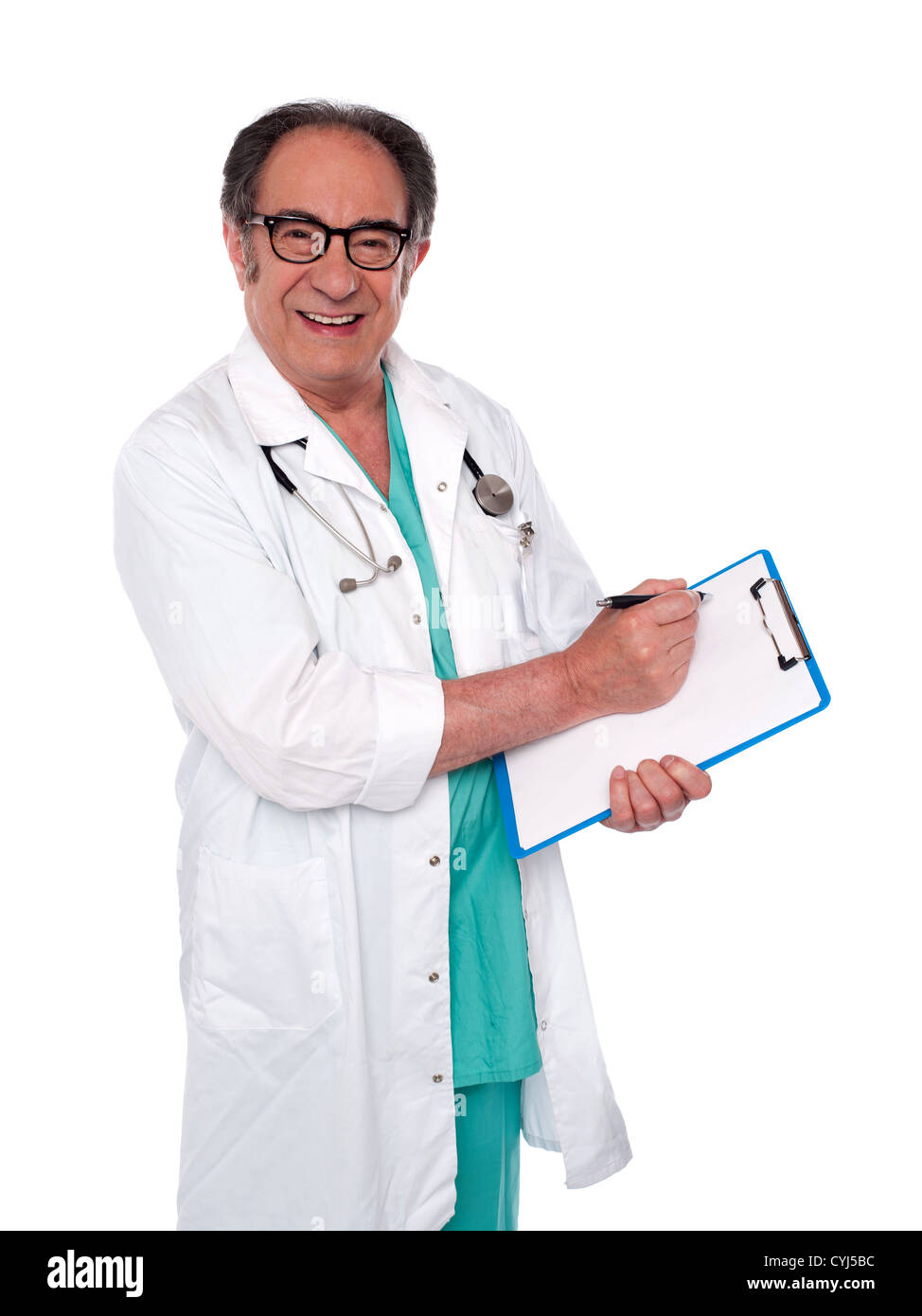 Senior surgeon writing medical report. Looking at camera and smiling ...