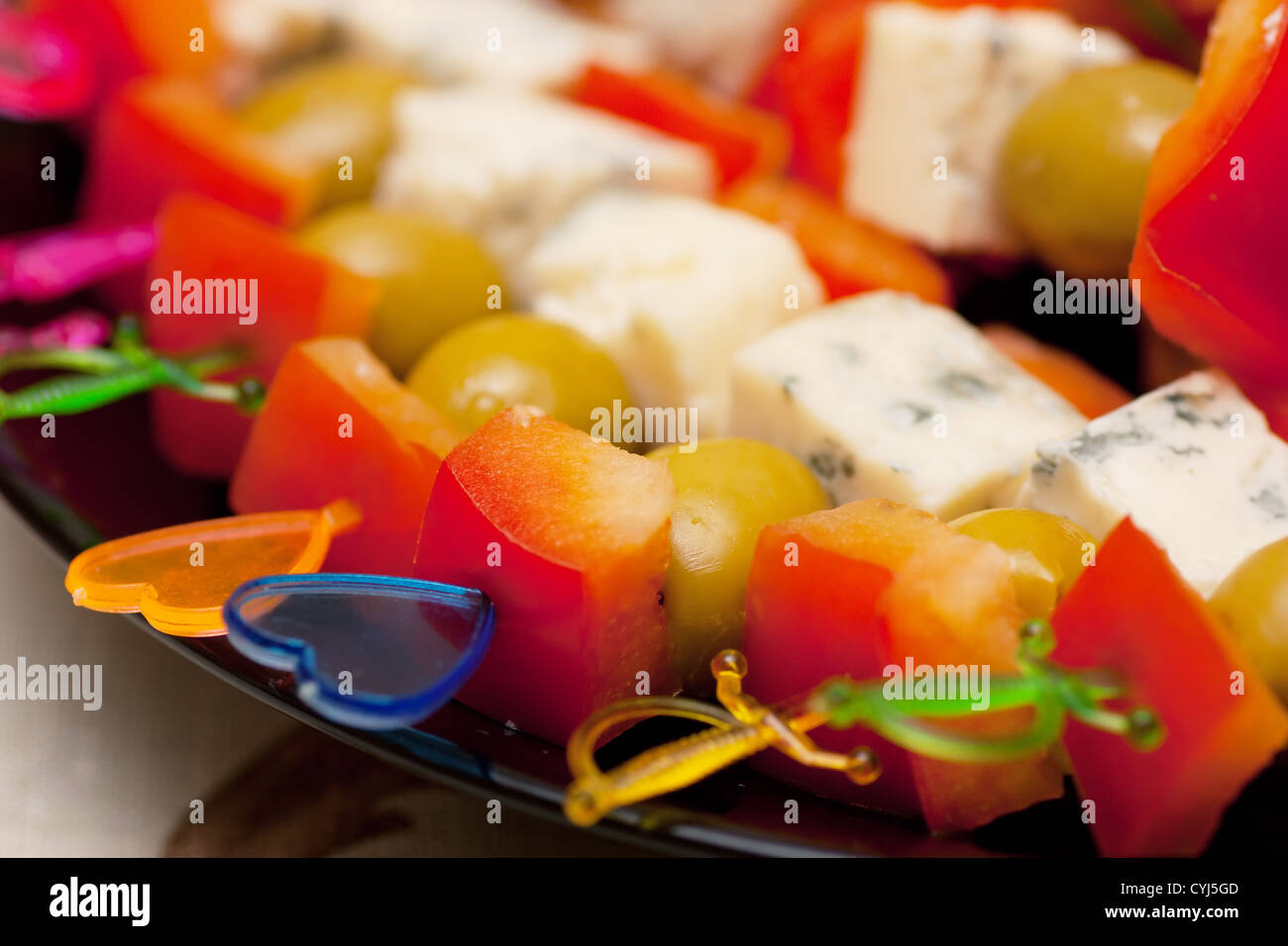 Closeup view of cocktail sticks with olive and cheese Stock Photo - Alamy