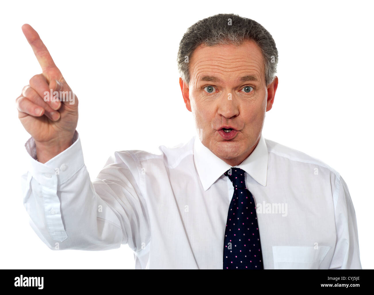 Businessman pointing up at copy space isolated over white background ...
