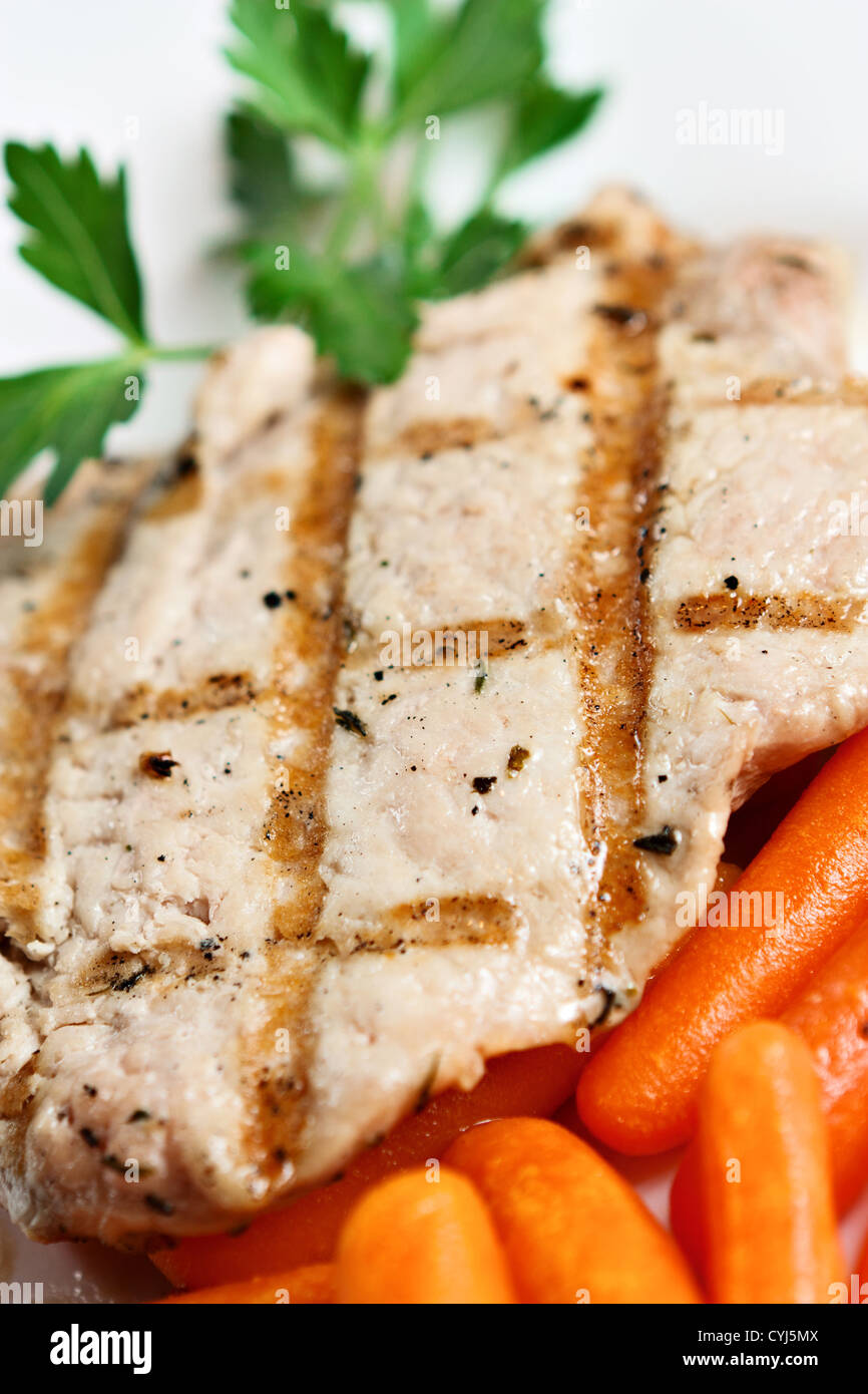 a large piece of roasted meat on a white background Stock Photo - Alamy