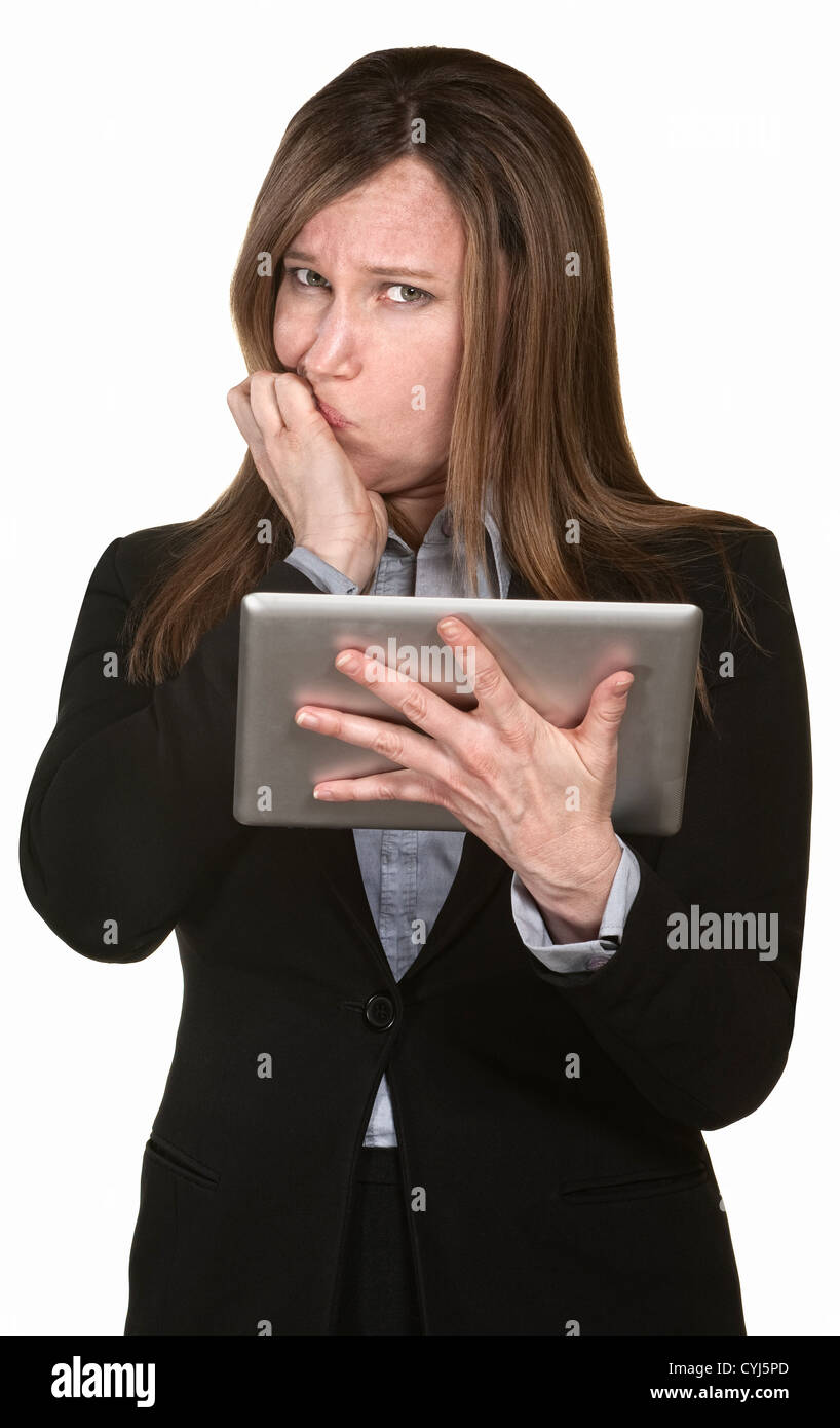 Scared lady holding tablet over white background Stock Photo - Alamy