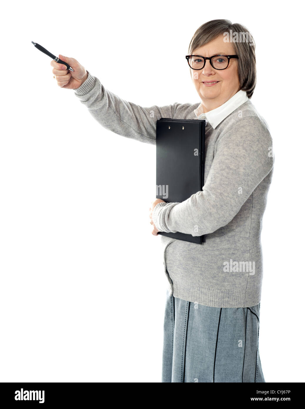 Female executive pointing away with pen in hand. Carrying business ...