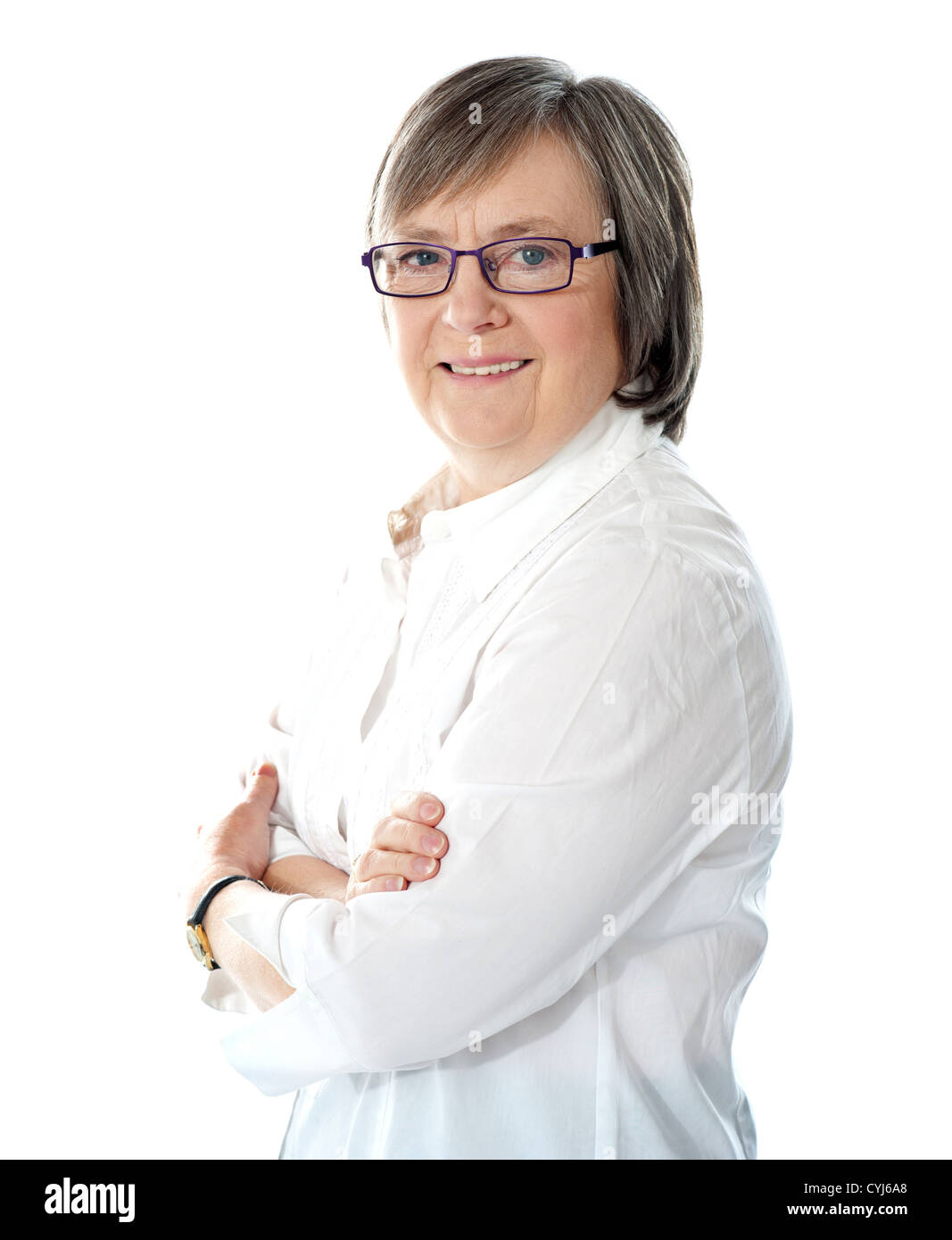 Side view of smiling senior female manager posing arms crossed Stock ...