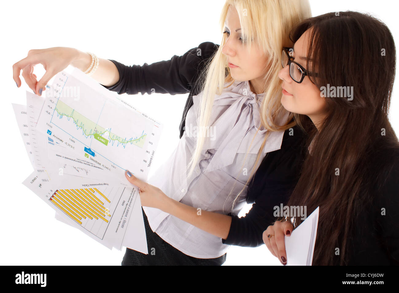 Two businesswoman looks on the graph on white background Stock Photo ...