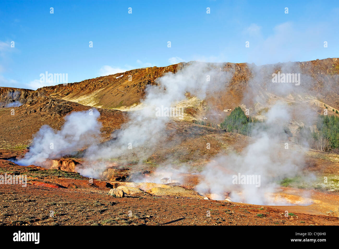 Smoke rising from hot springs in Iceland Stock Photo - Alamy