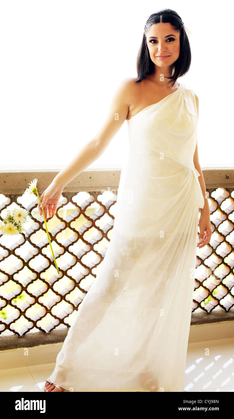Young happy smiling bride with flower isolated, wedding day Stock Photo ...