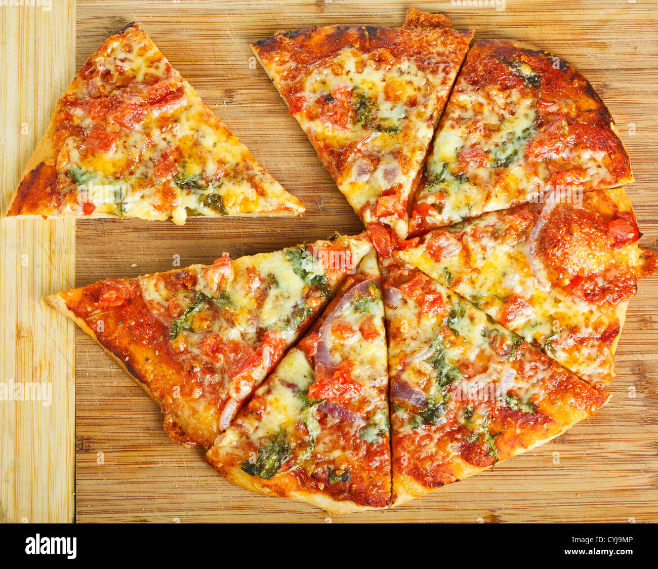 Homemade pizza on chopping board Stock Photo - Alamy