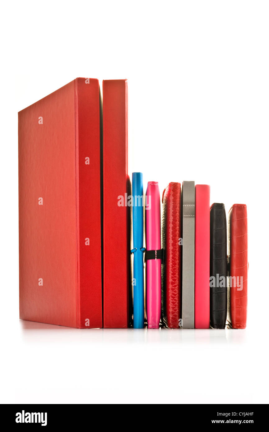 Close up of stacked up books on a white background with space for text ...