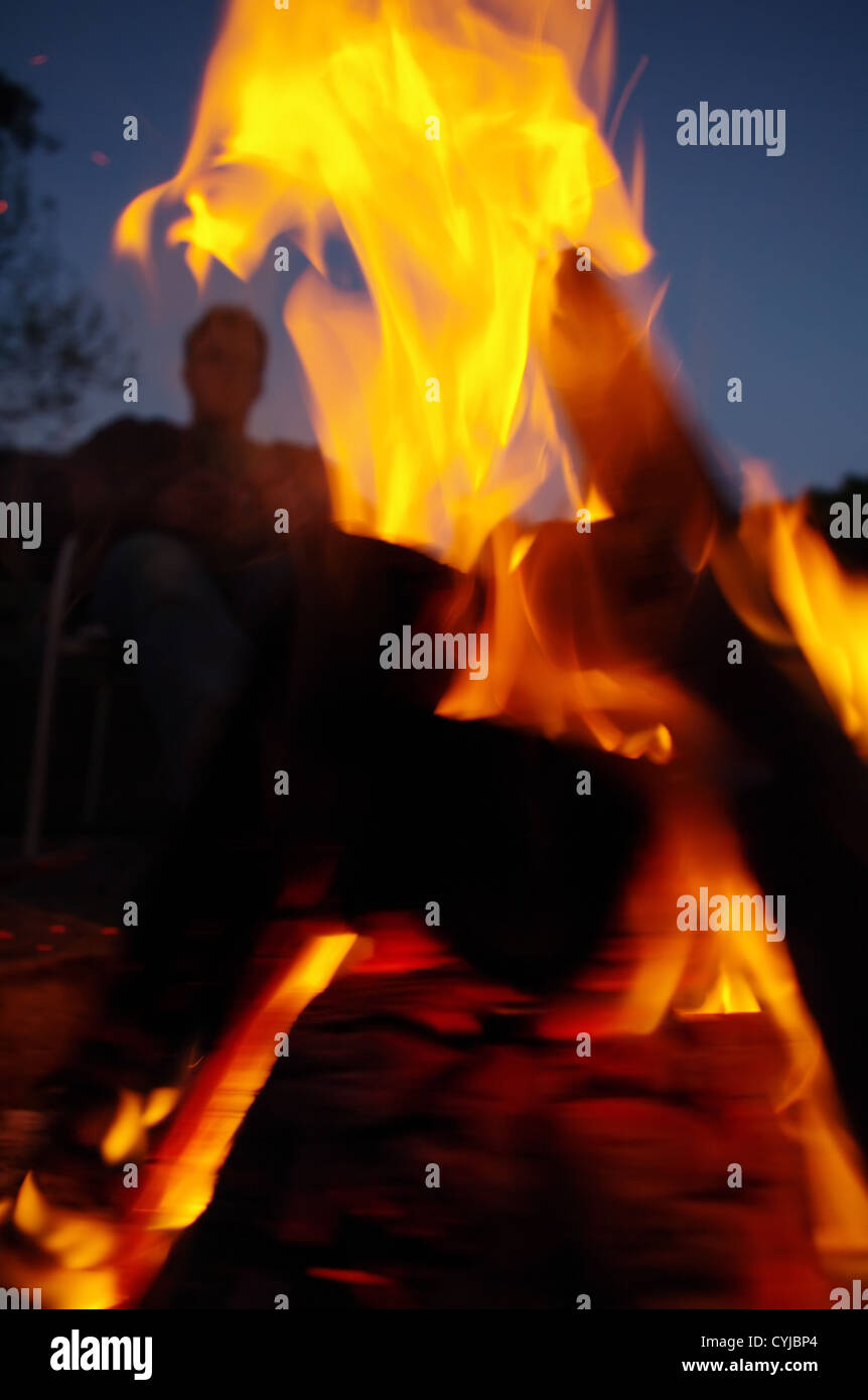 a nice campfire burning outside in summer Stock Photo - Alamy