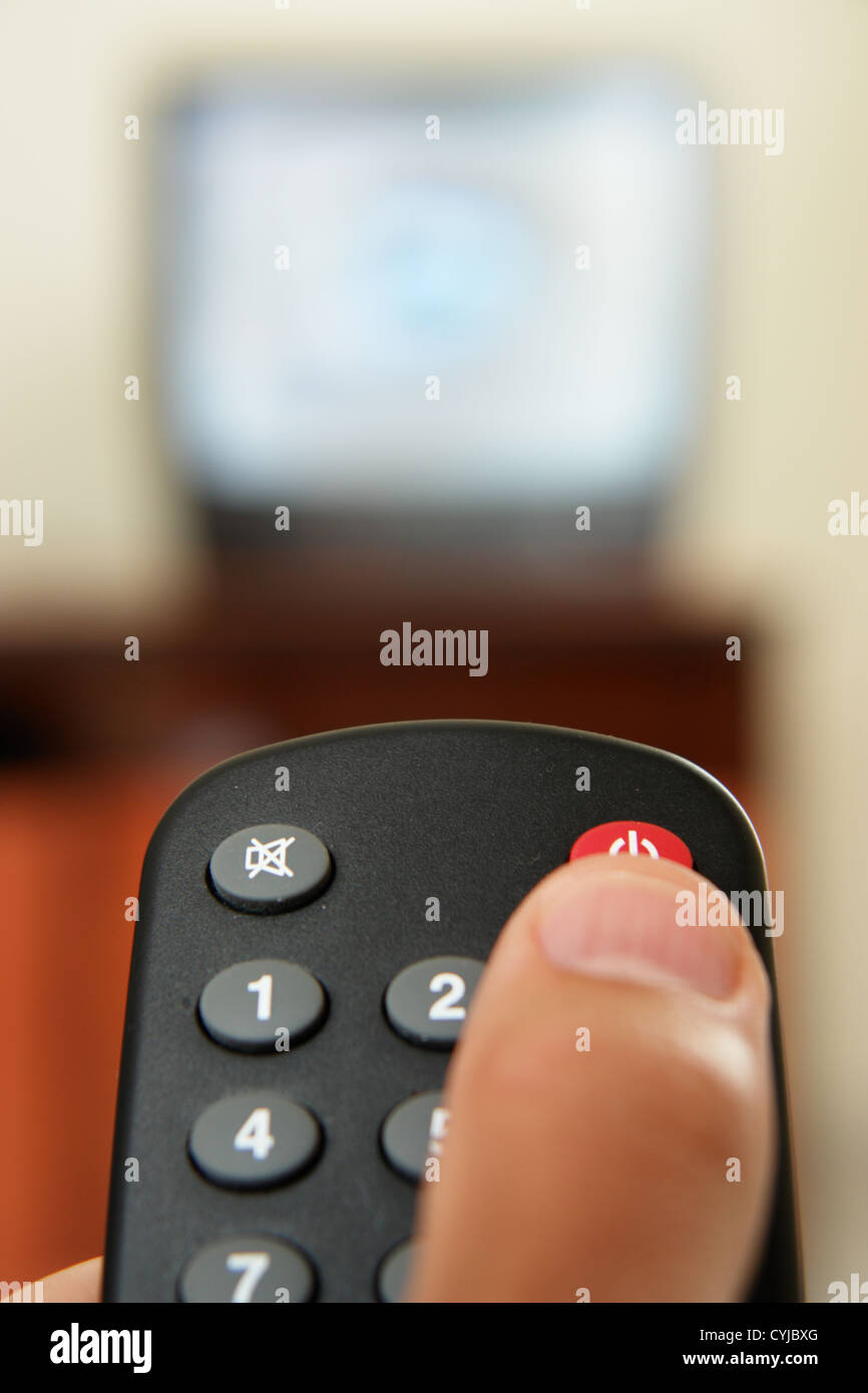 Television screen with tv remote control in foreground Stock Photo - Alamy