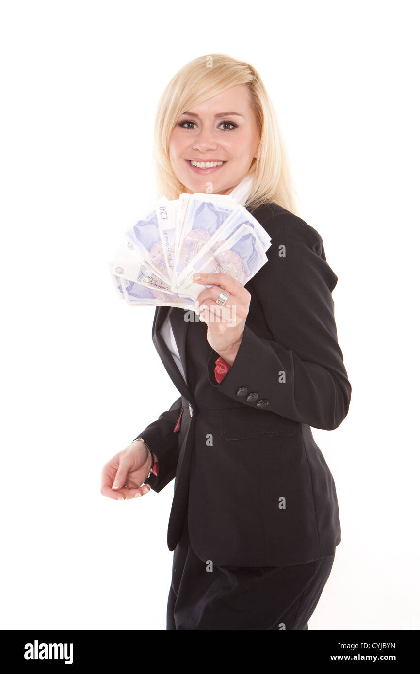 Ecstatic beautiful woman in a stylish suit holding a fistful of money ...