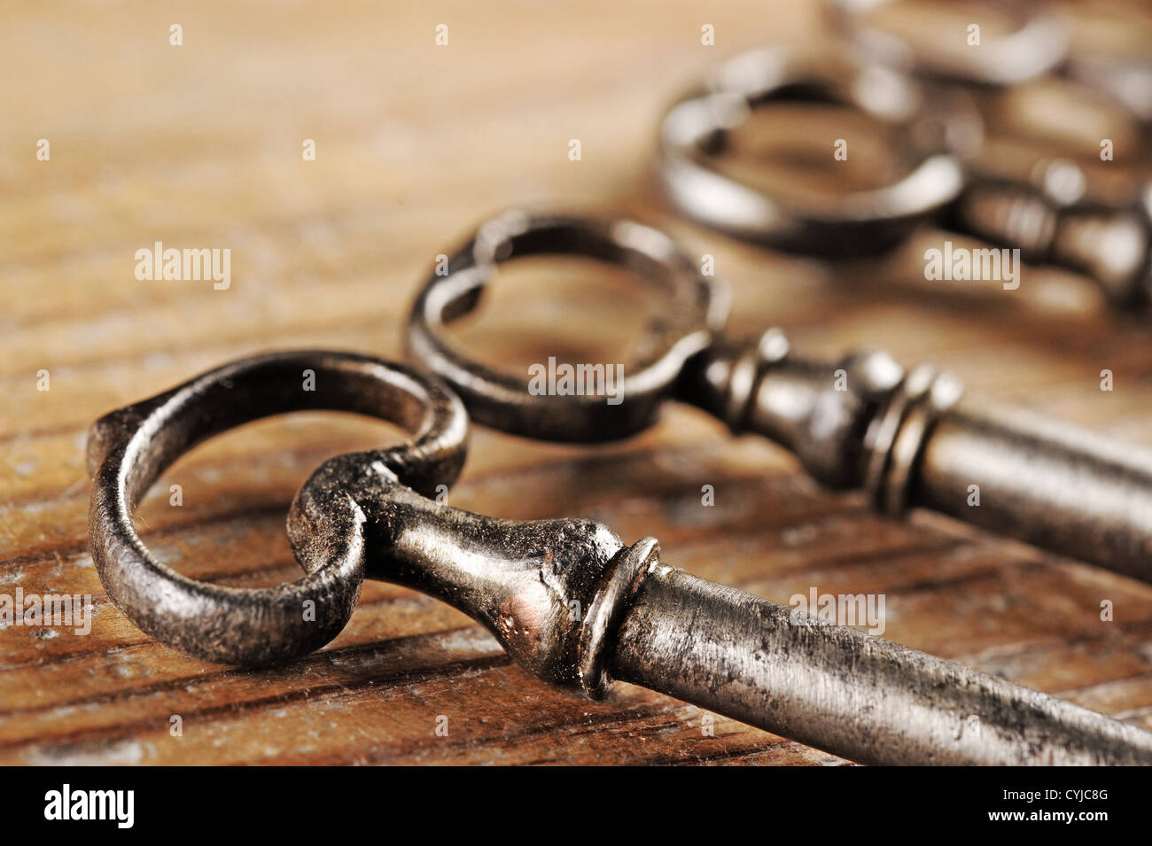 old keys on a wooden table, close-up Stock Photo - Alamy