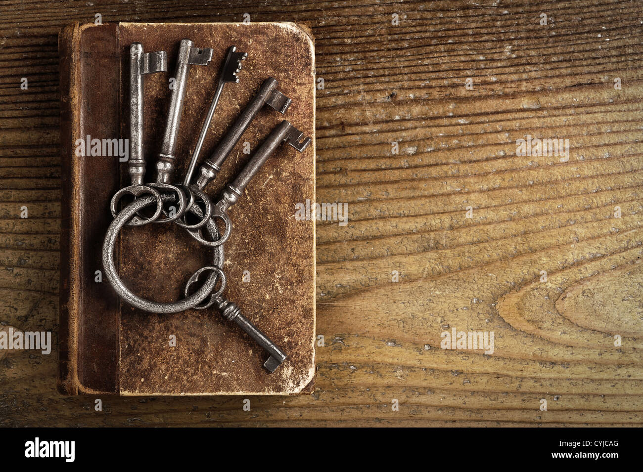old keys on a old book, antique wood background Stock Photo - Alamy