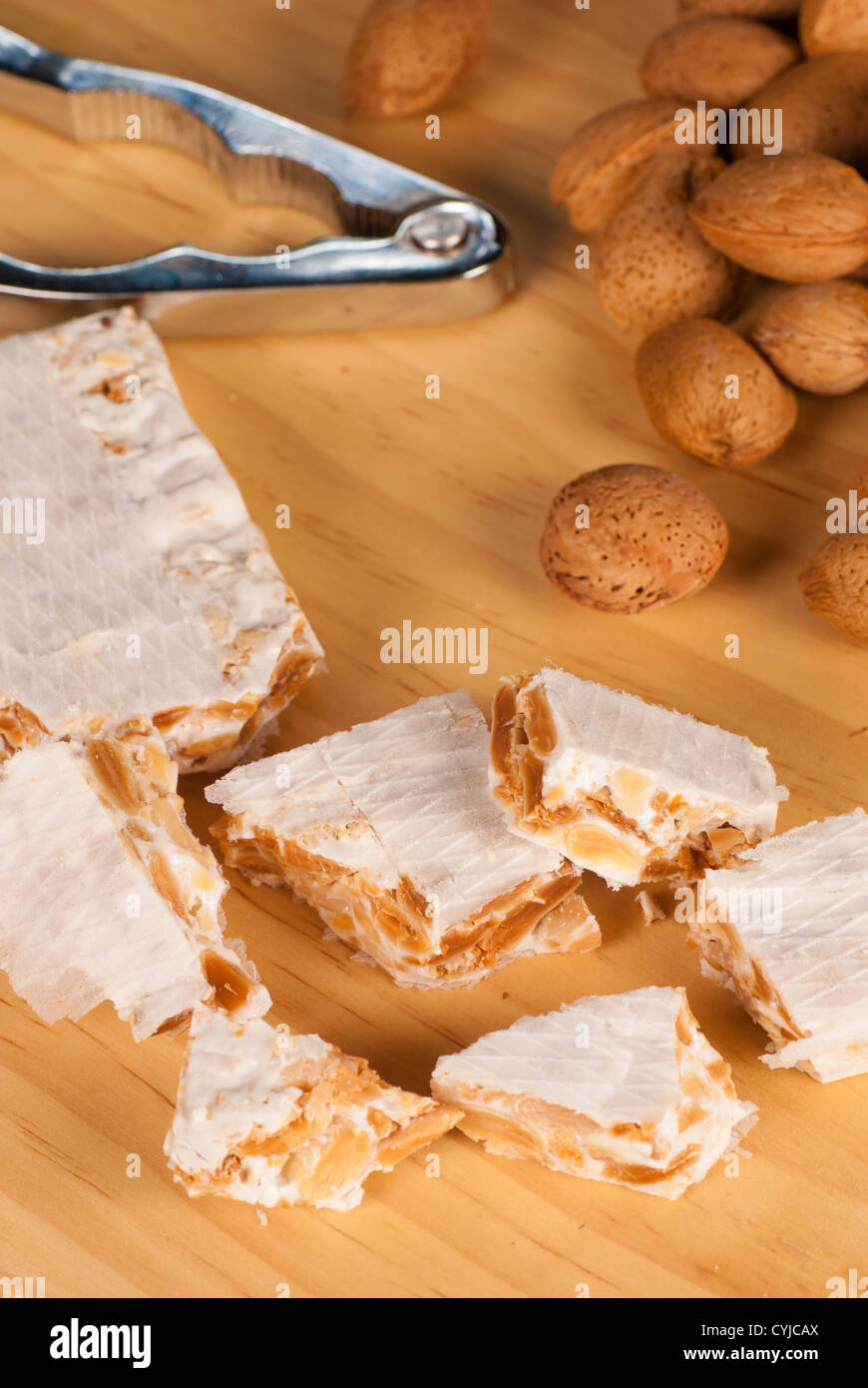 Traditional turron next to fresh almonds Stock Photo - Alamy
