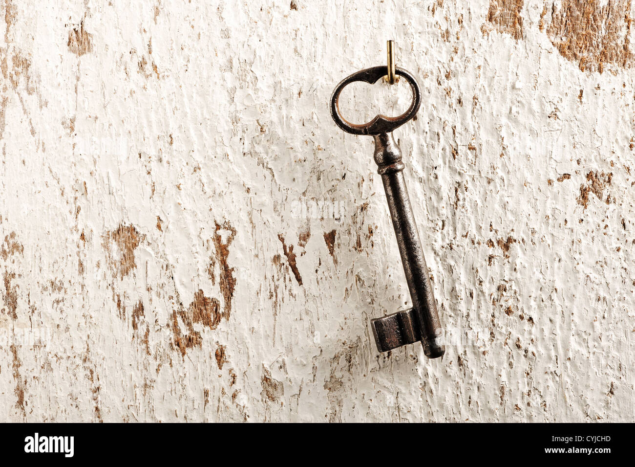 old key, wall background Stock Photo - Alamy