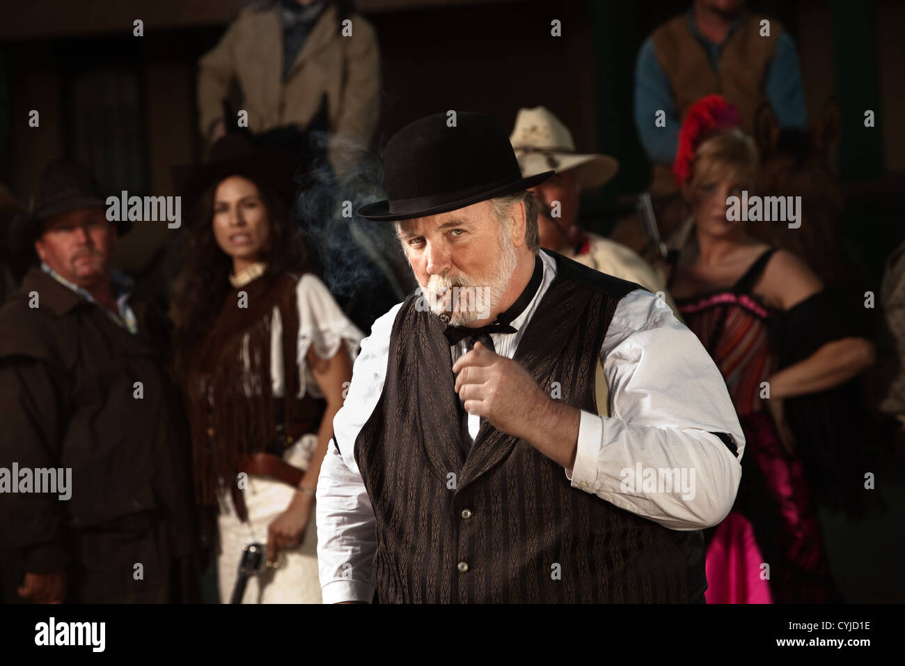 Overweight 1800s style man in front of bandit gang Stock Photo - Alamy
