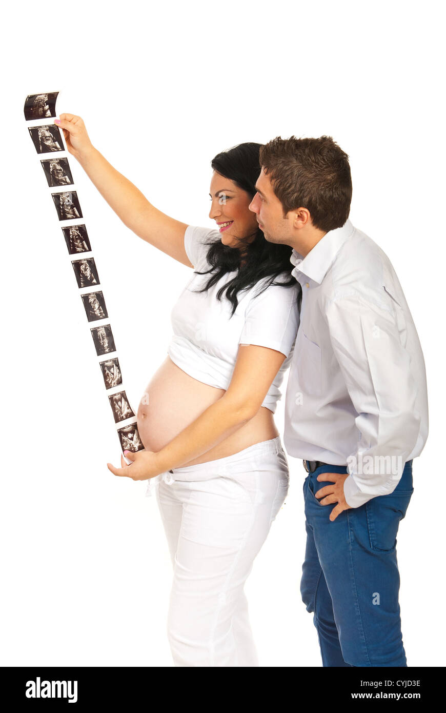 Pregnant couple looking at sonogram images together isolated on white ...