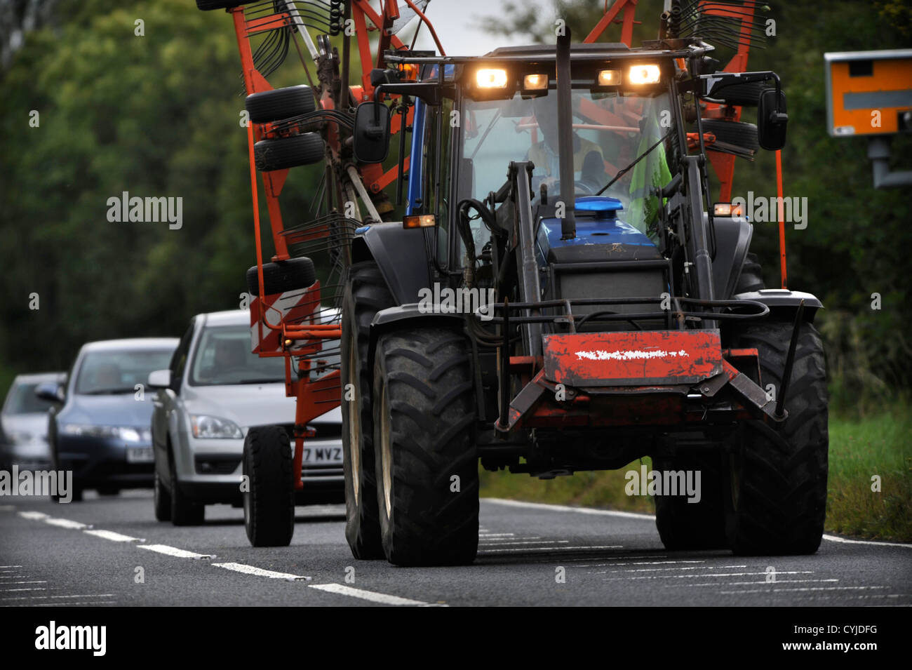 Cars stuck behind a tractor on a road in Gloucestershire UK Stock Photo ...