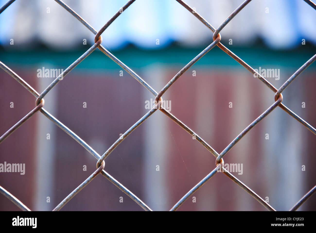 Mesh fence abstract blue background Stock Photo - Alamy