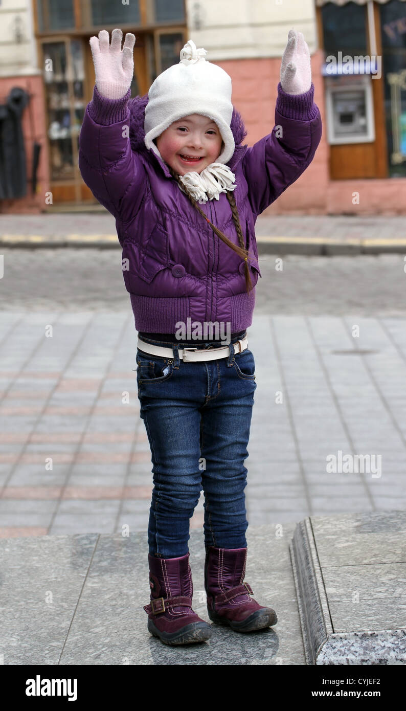 Portrait of beautiful happy girl holding hands up Stock Photo - Alamy