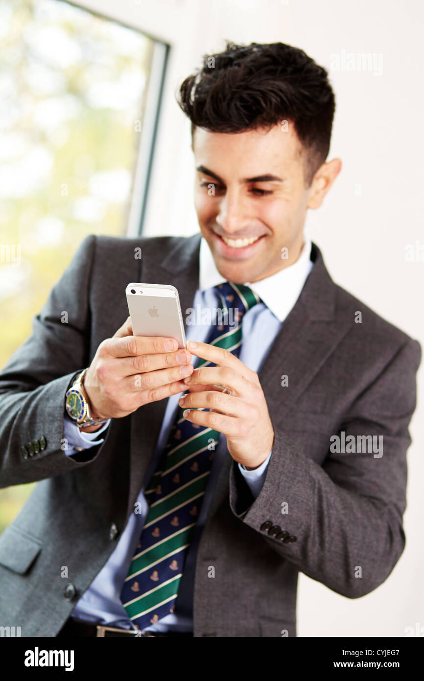 Man using iPhone 5 Stock Photo - Alamy