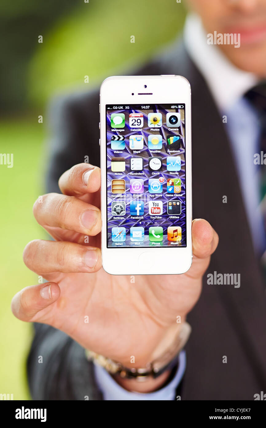 Man holding iPhone 5 Stock Photo - Alamy