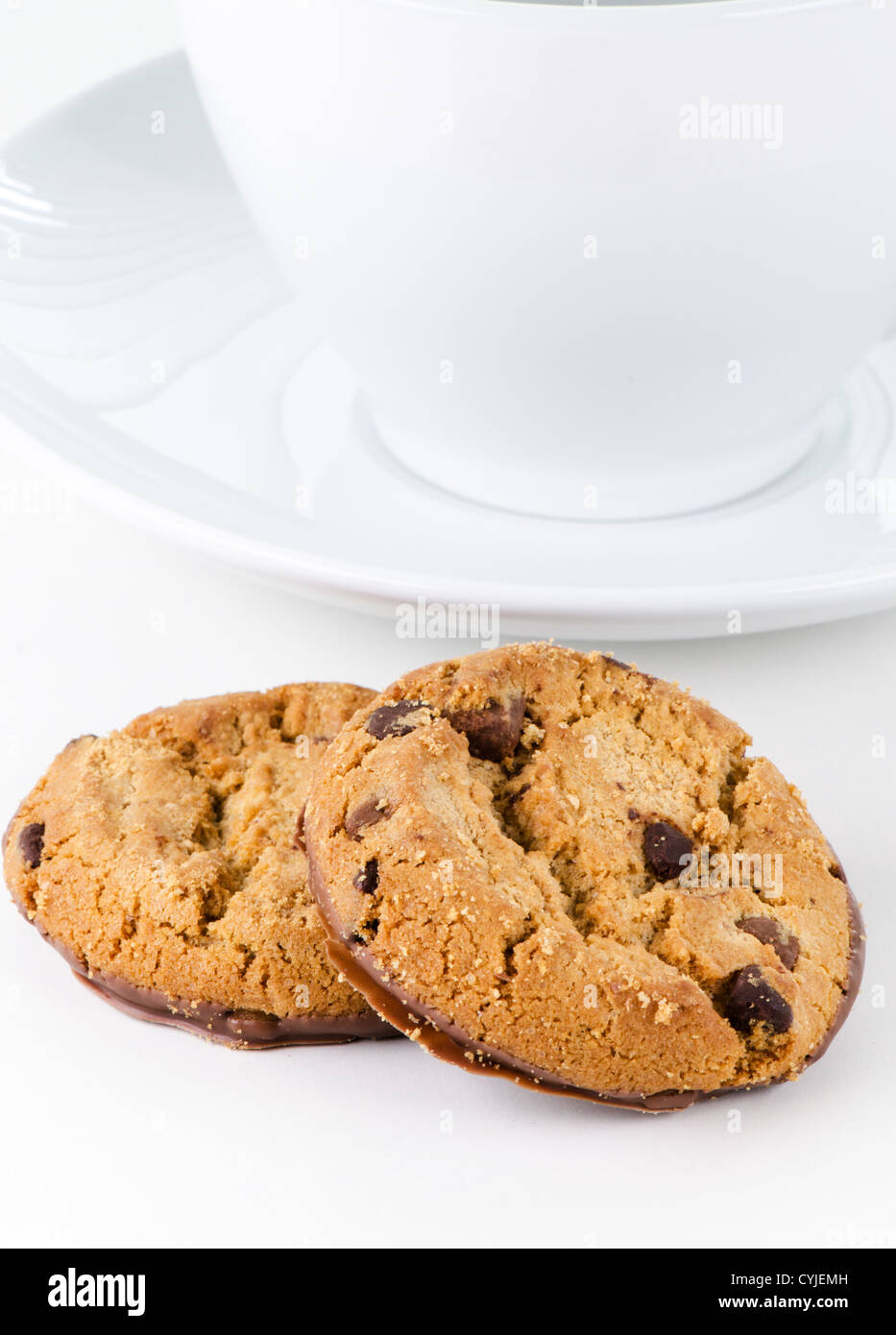 Two cookies on cup background Stock Photo - Alamy
