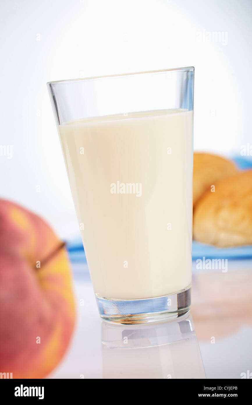 Breakfast with milk, brioche and apple Stock Photo - Alamy