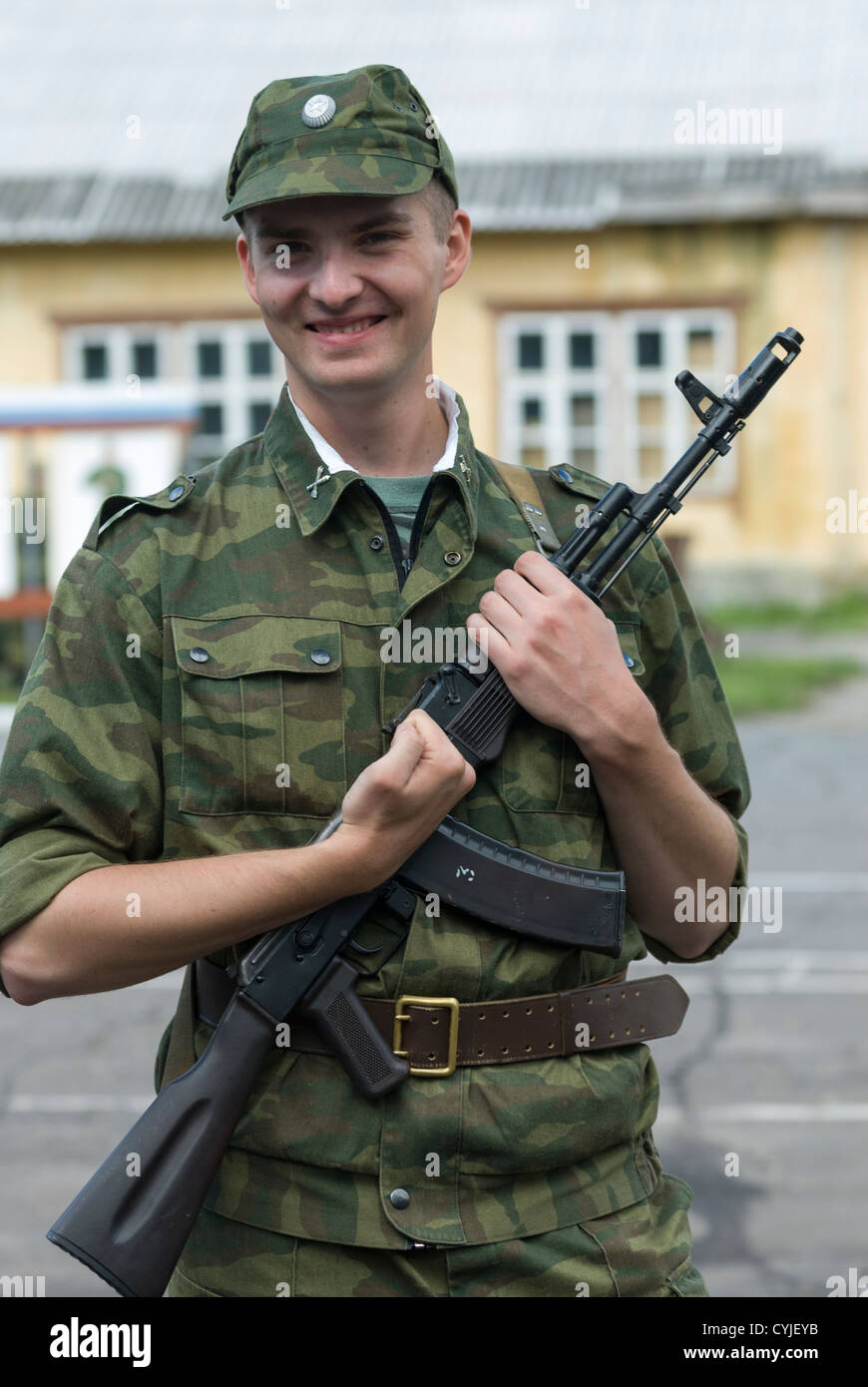 Cheerful young soldier with AK-47 Kalashnikov automatic rifle Stock ...