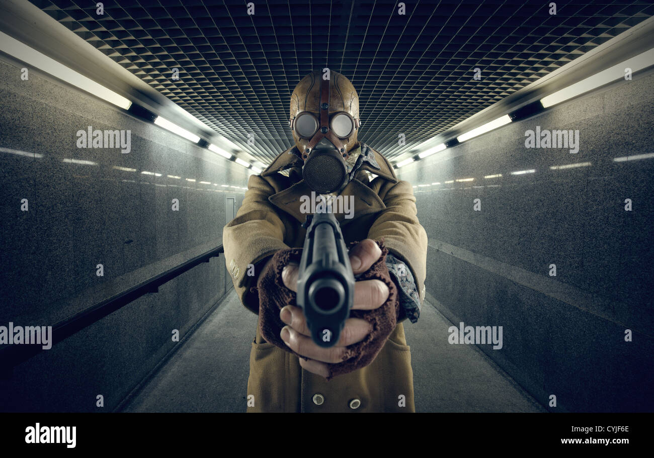 grunge portrait man in gas mask pointing a gun Stock Photo - Alamy